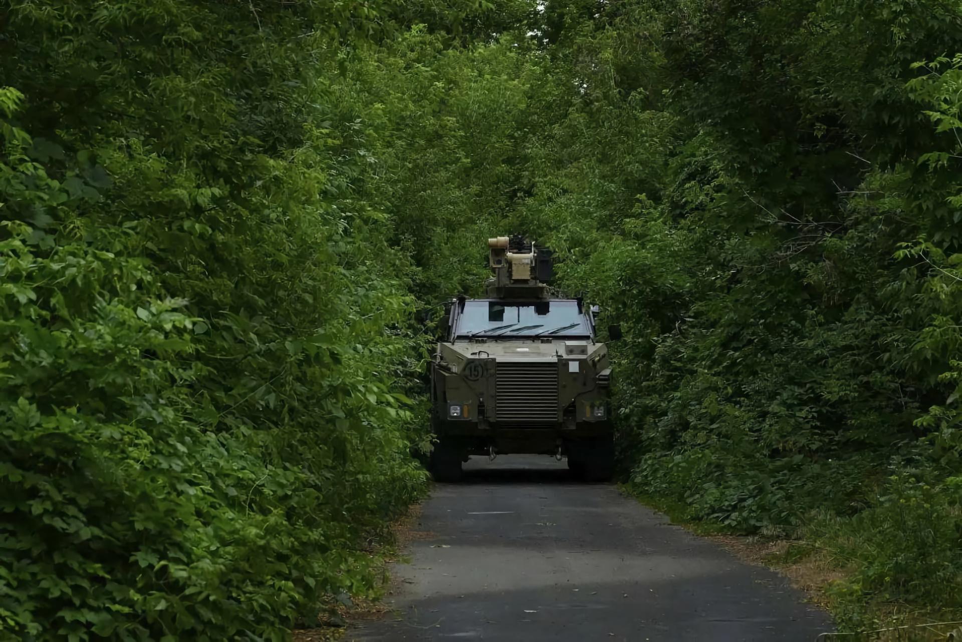 Australian Bushmaster armored vehicles with an EOS R400-Mk2 combat ...
